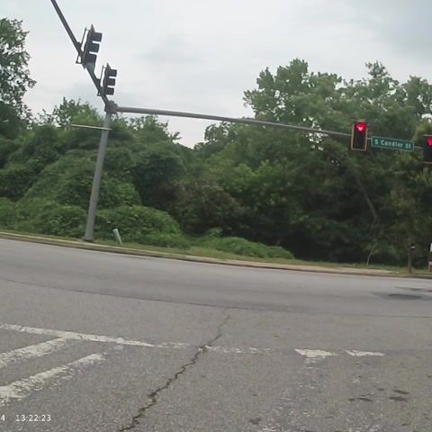 Multiple cars running red light with pedestrians & people on bicycles ...